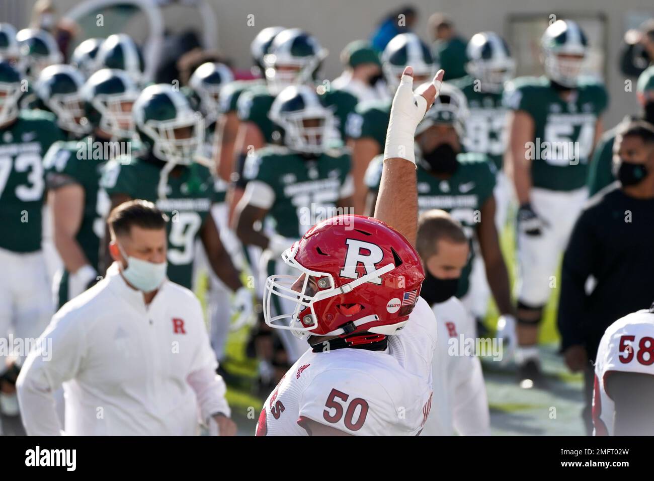 Rutgers offensive lineman Cj Hanson (50) looks towards his family after ...