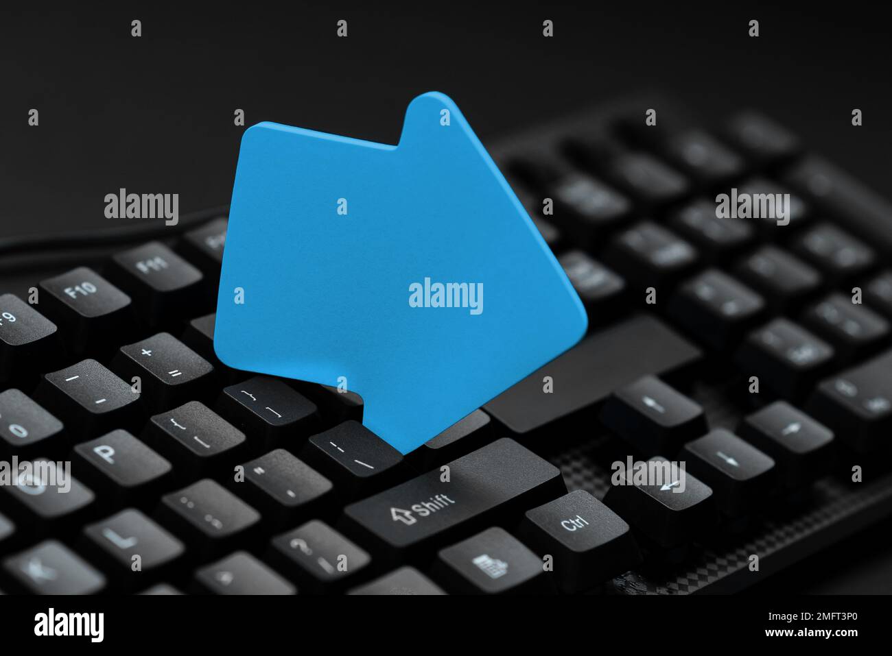 Colored sticker lying on black keyboard. Important information written ...