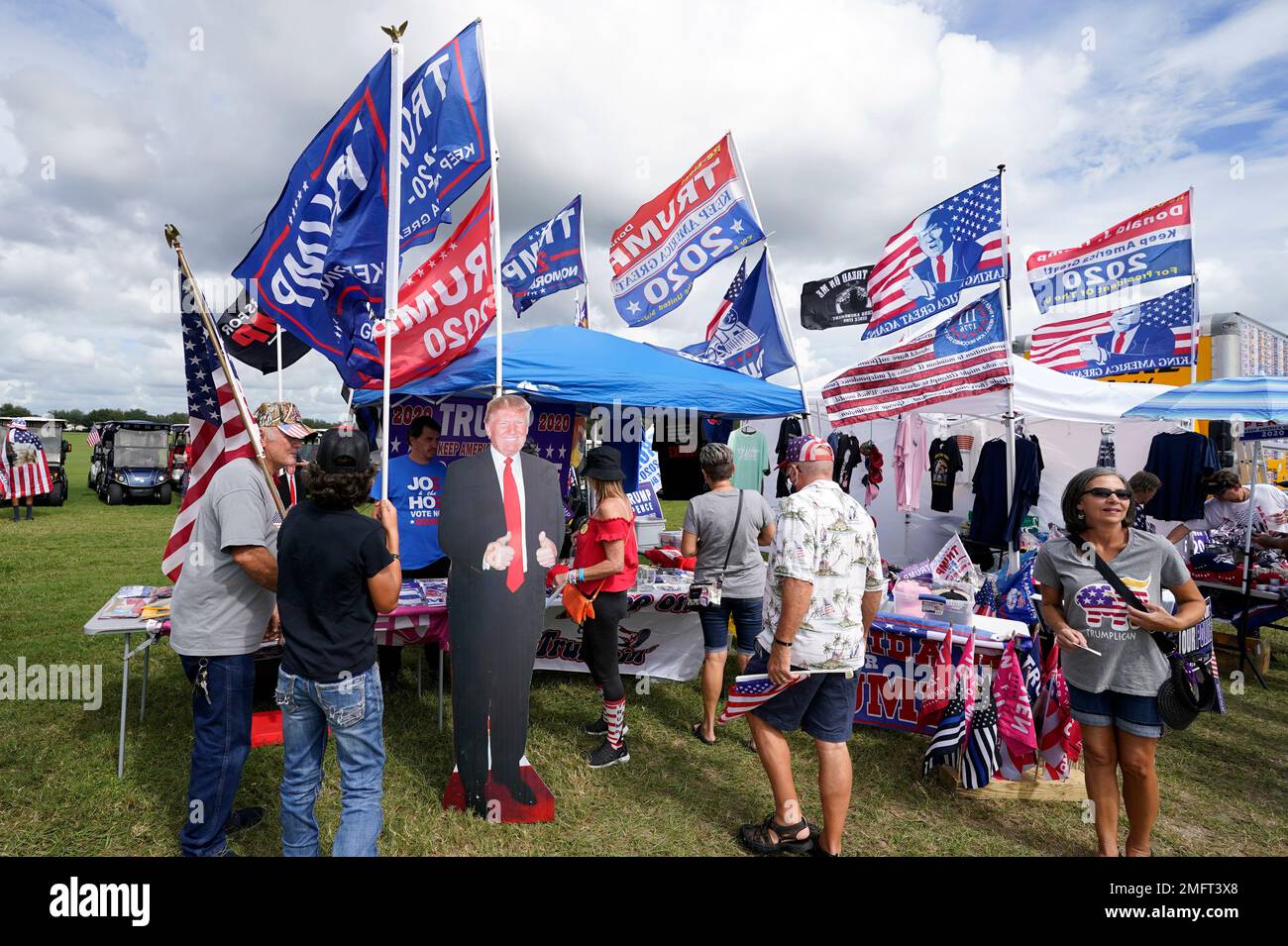 Supports gather around a vendors stand selling merchandise before a ...
