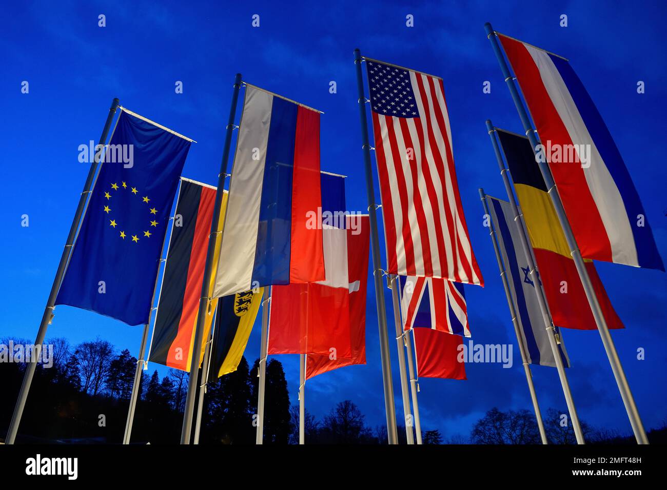 National flag, Waving flags in front of the spa hotel, blue hour, blue ...