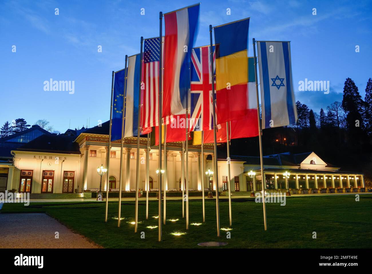 National flag, Waving flags in front of the spa hotel, blue hour, blue ...
