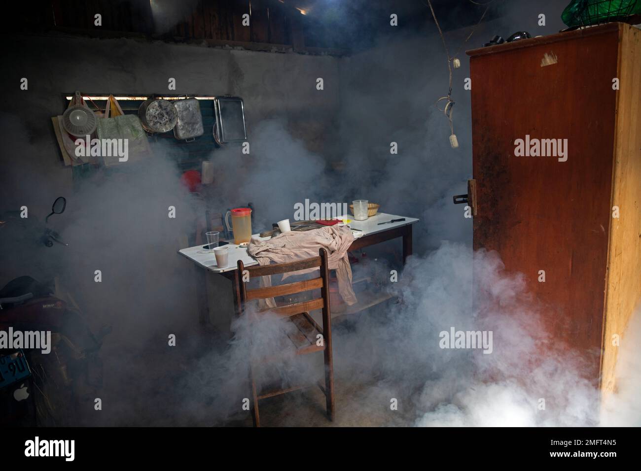 Clouds of insecticide seep into a dining room during a fumigation ...
