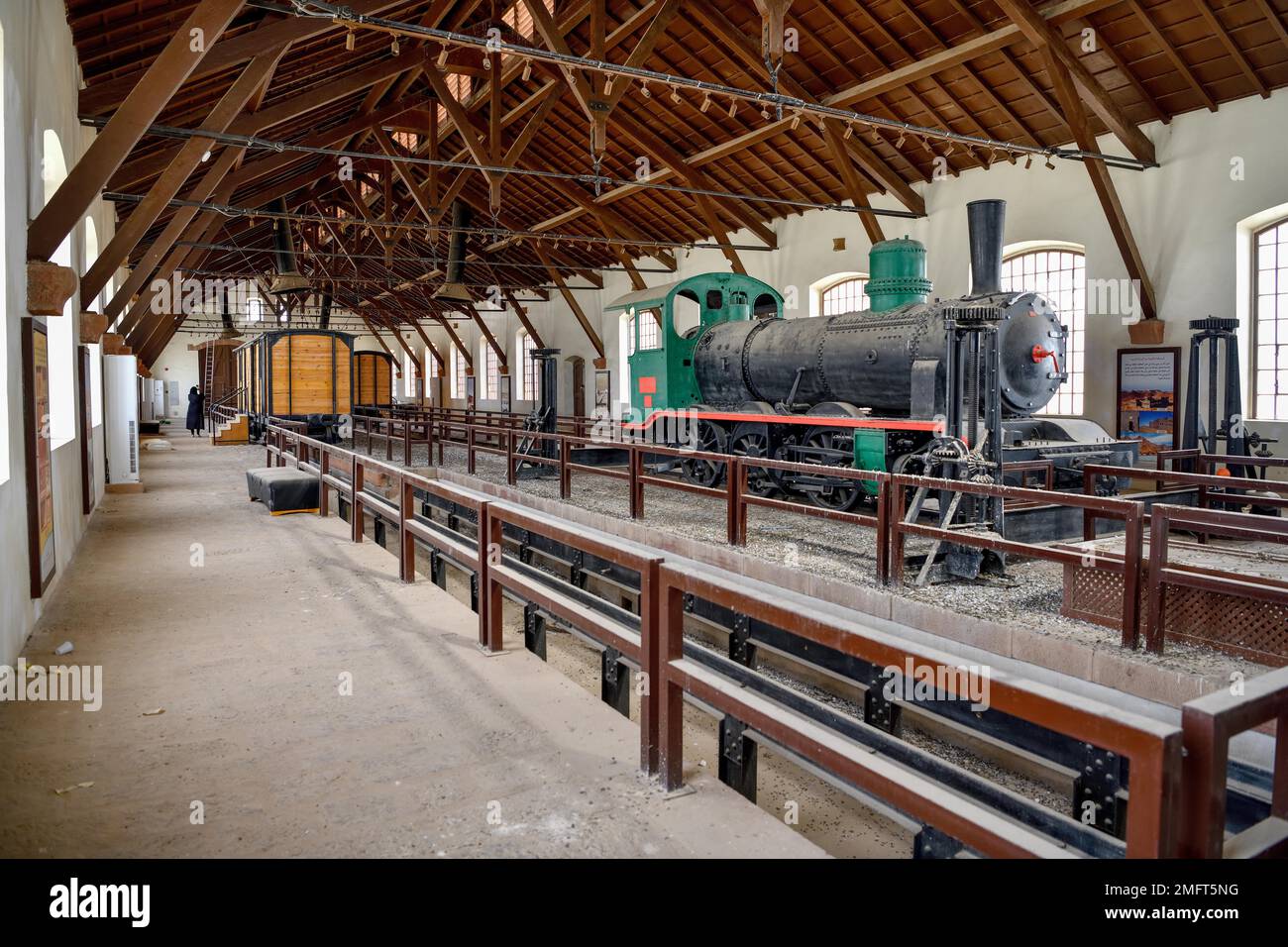 Historic train of the Hejaz Railway in a renovated station building of ...