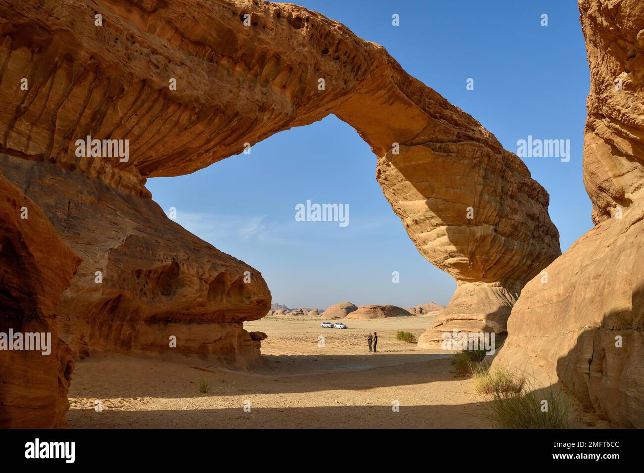 Tourists at The Arch, also known as Rainbow Rock, near AlUla, Medina ...