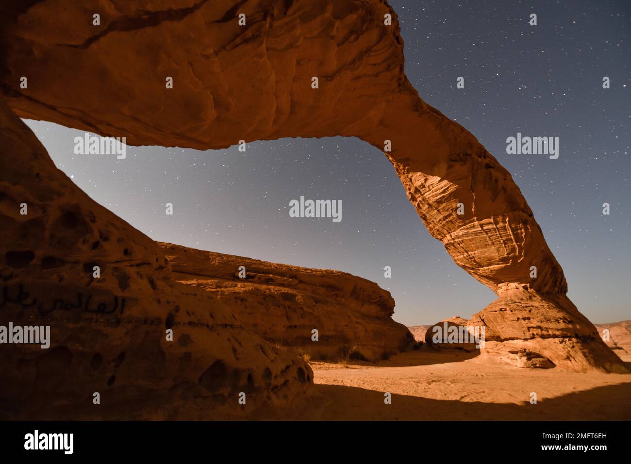 Starry sky above The Arch, also known as Rainbow Rock, near AlUla ...