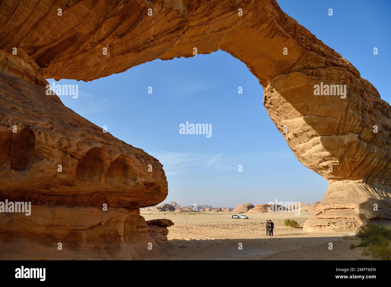 Tourists at The Arch, also known as Rainbow Rock, near AlUla, Medina ...