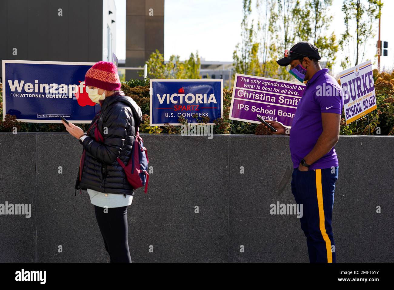 Voters wait in line to cast their ballot in the 2020 Presidential ...
