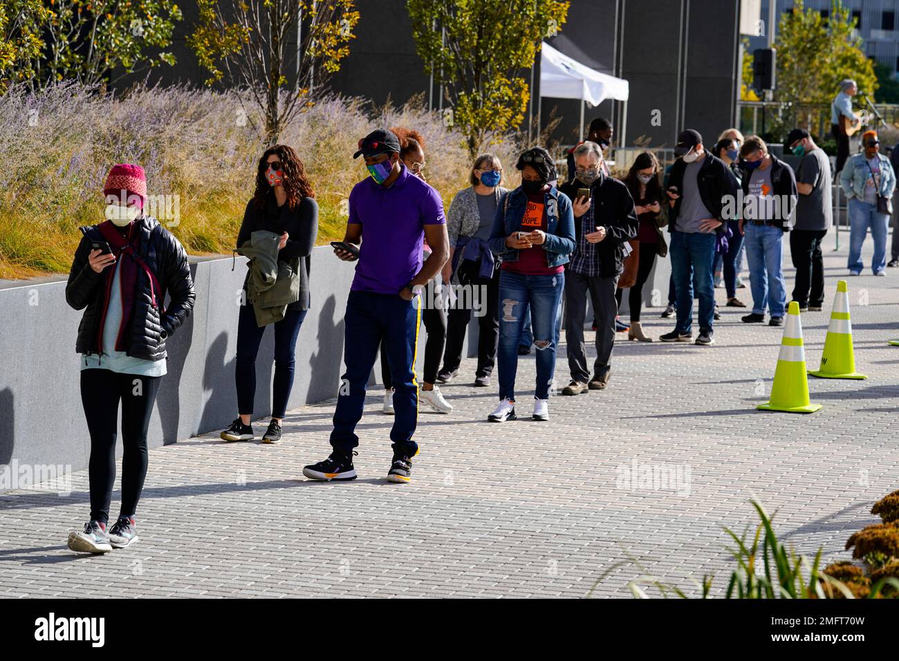 Voters wait in line to cast their ballot in the 2020 Presidential ...