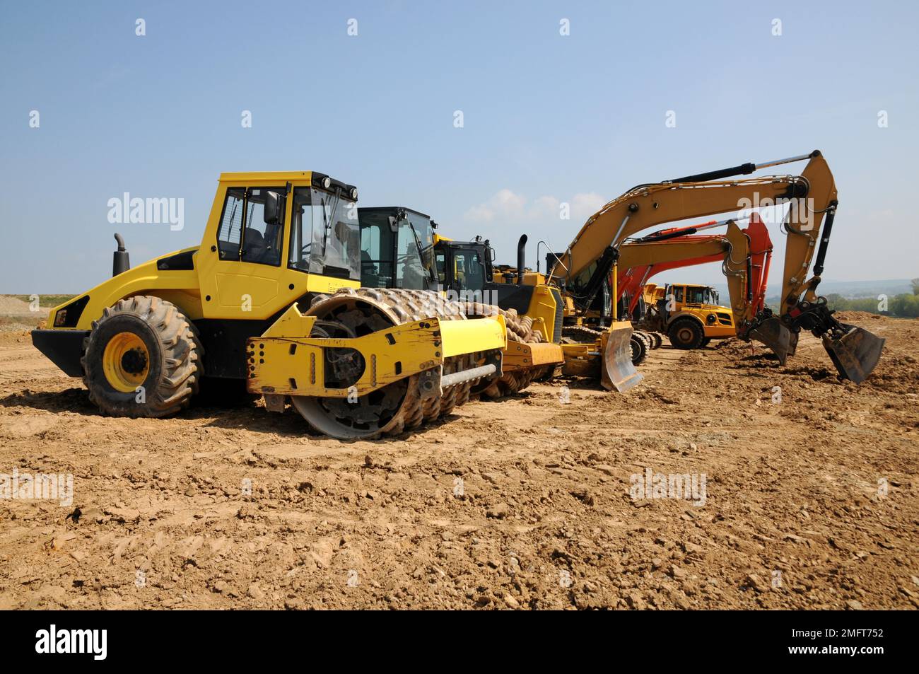 Excavators and bulldozers working on large construction site, Hesse ...