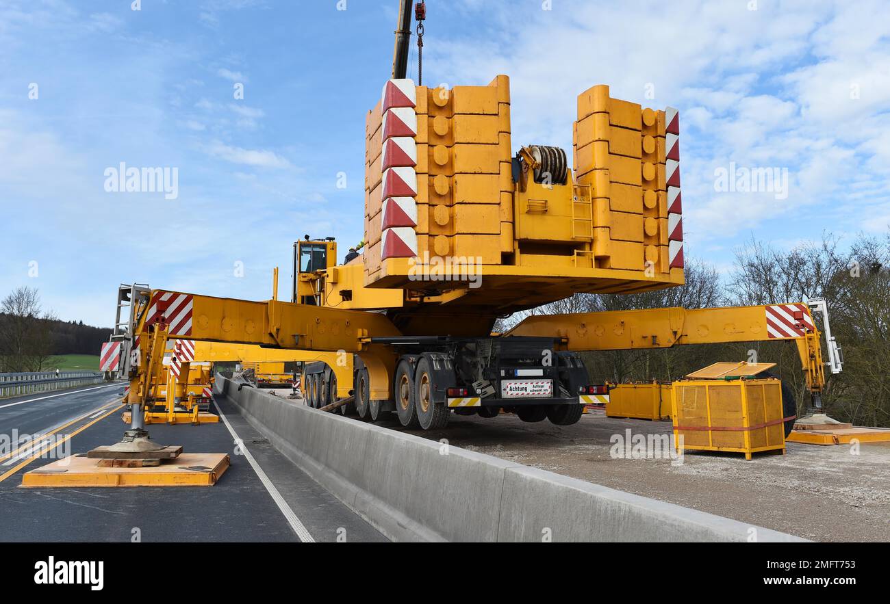 Counterweights and outriggers, supports, of a truck-mounted crane ...