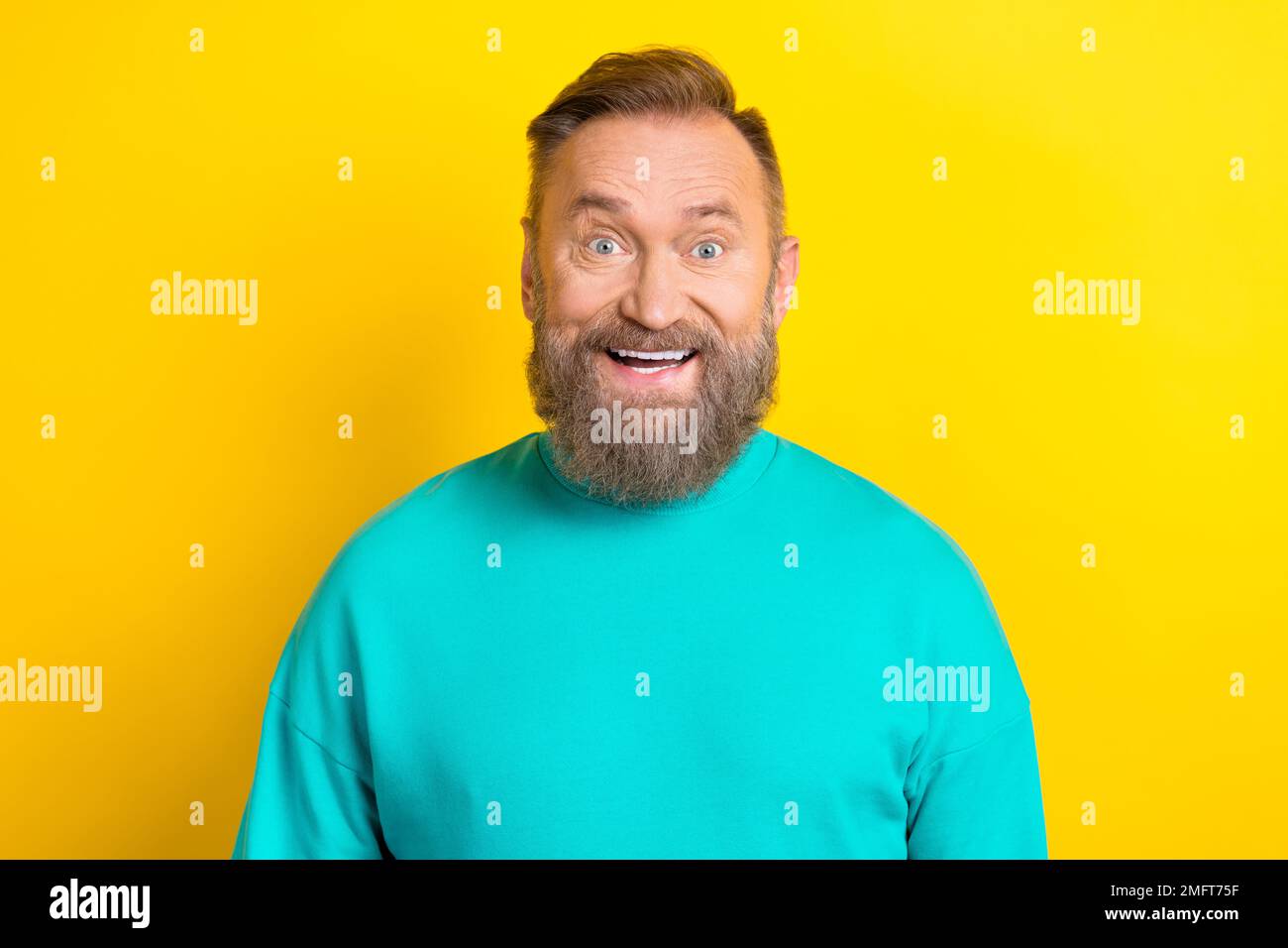 Photo of astonished cheerful man wear bright aquamarine trendy clothes ...