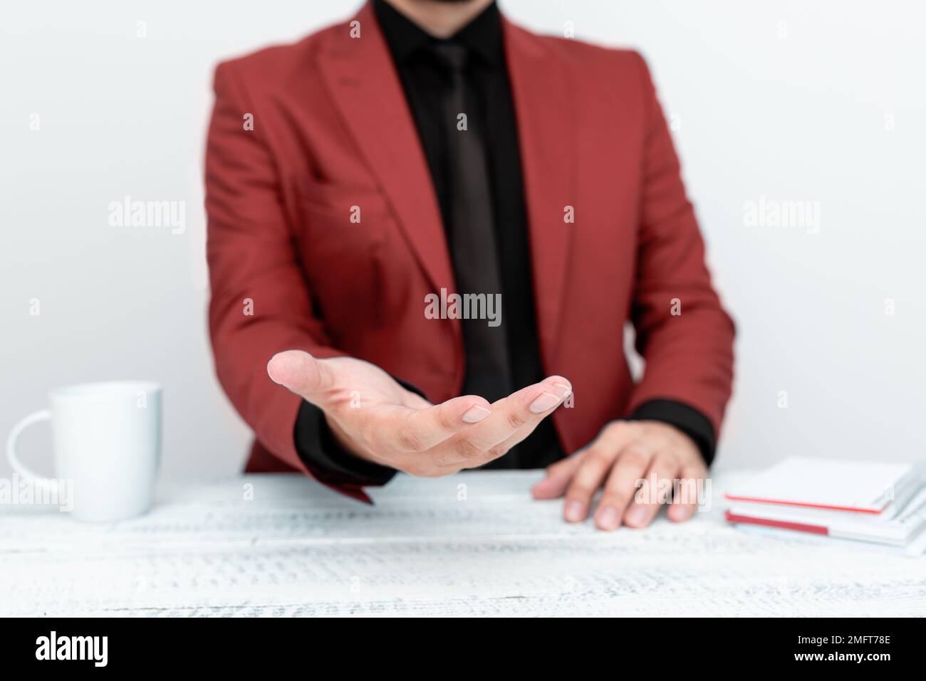 Man in suit holding book close up hi-res stock photography and images ...