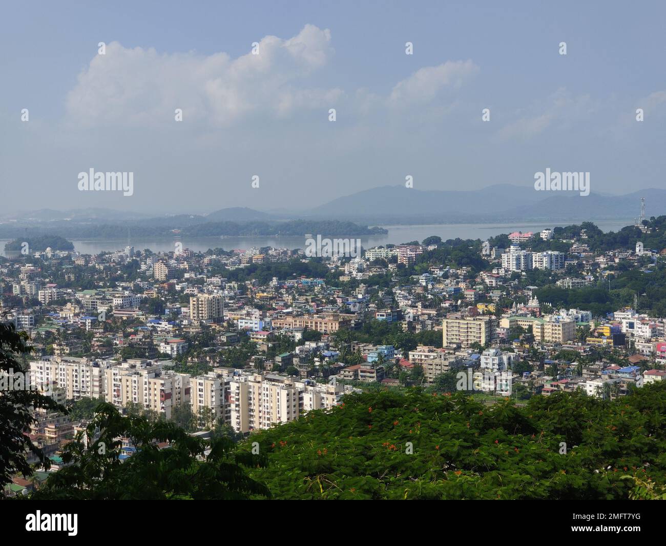 A bird's eye view of the Dhubri townscape surrounded by green ...
