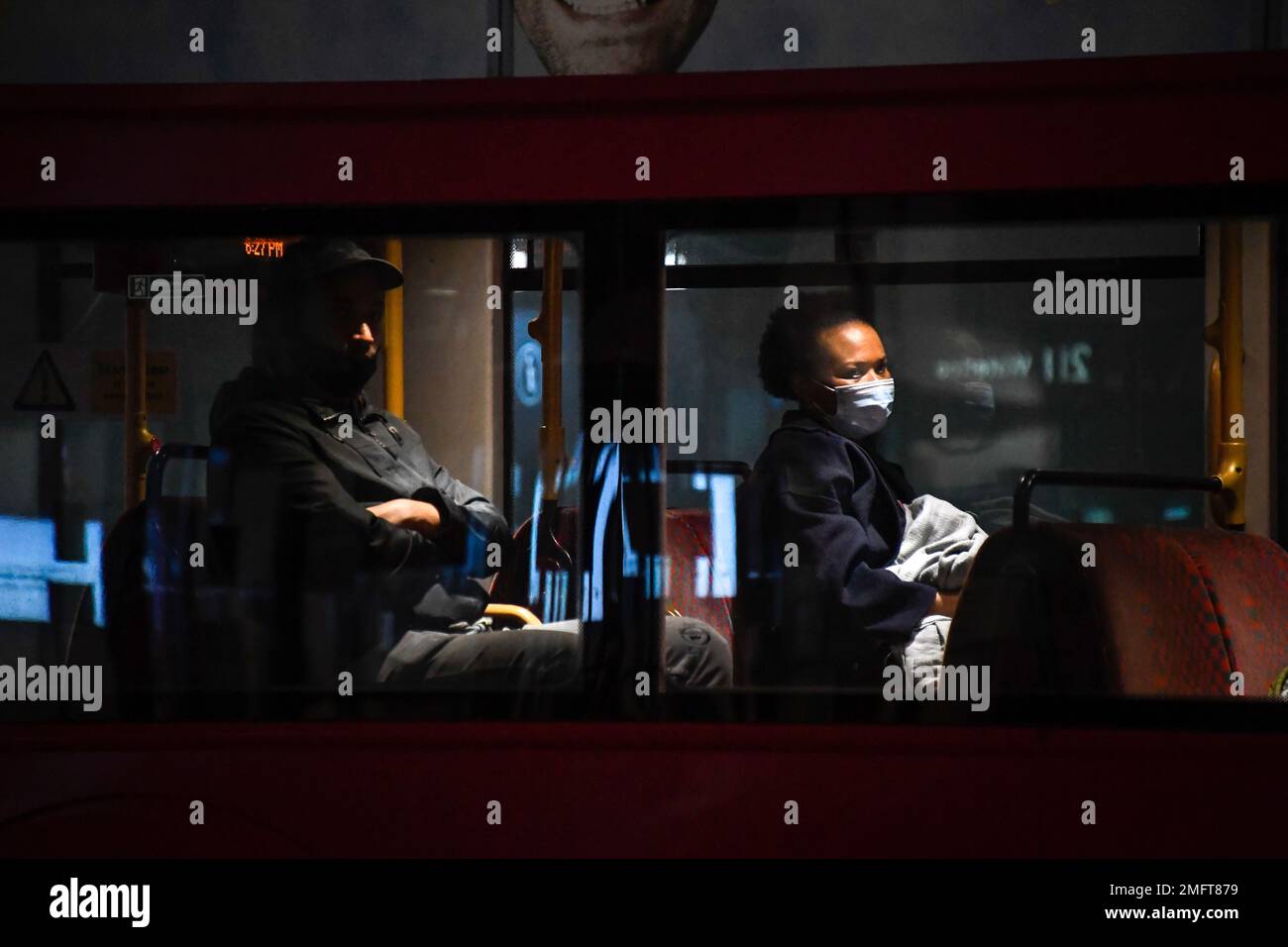 Passengers wear face masks to protect against coronavirus, on board a ...