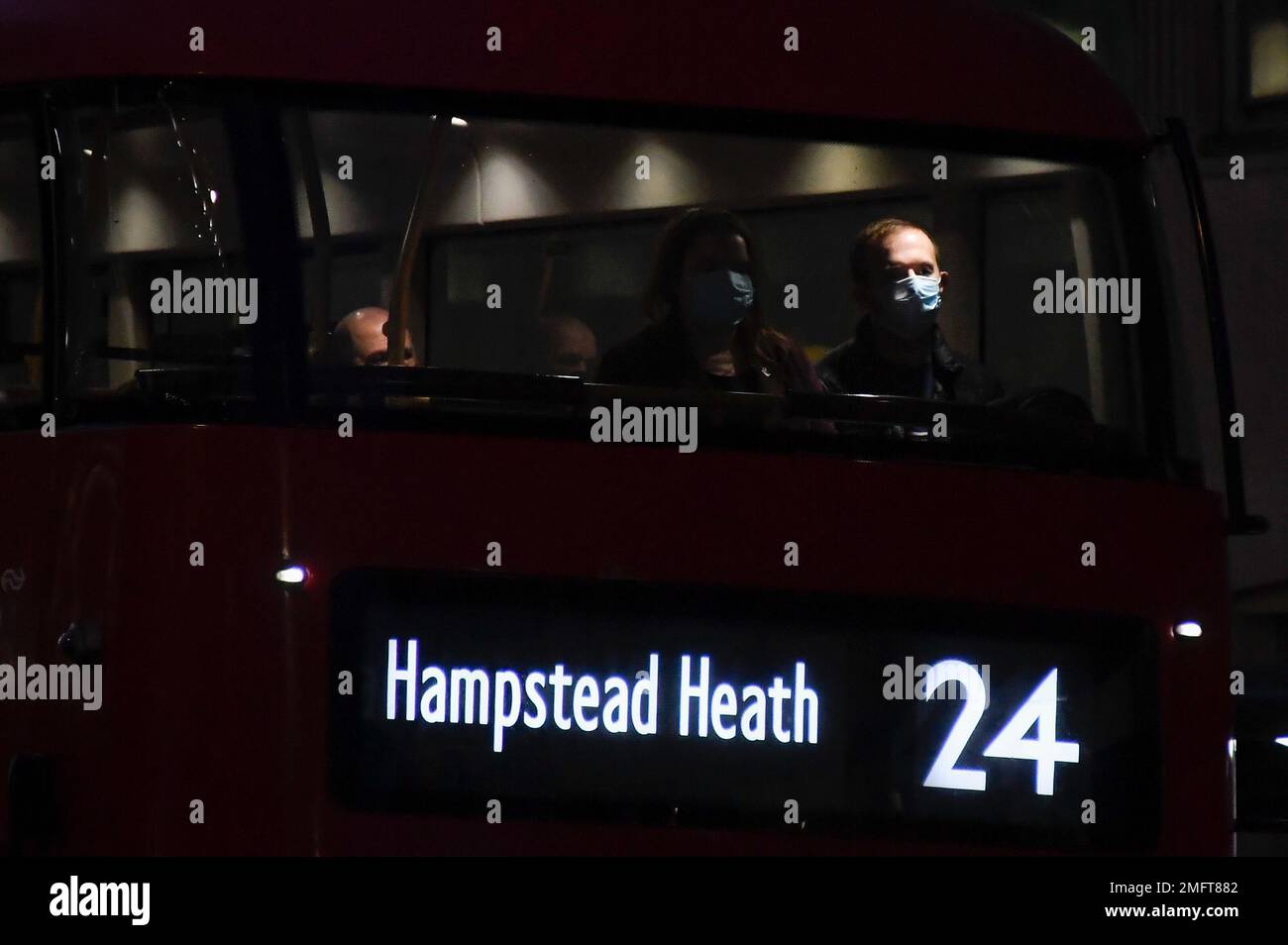 Passengers wear face mask to protect against coronavirus, on board a ...