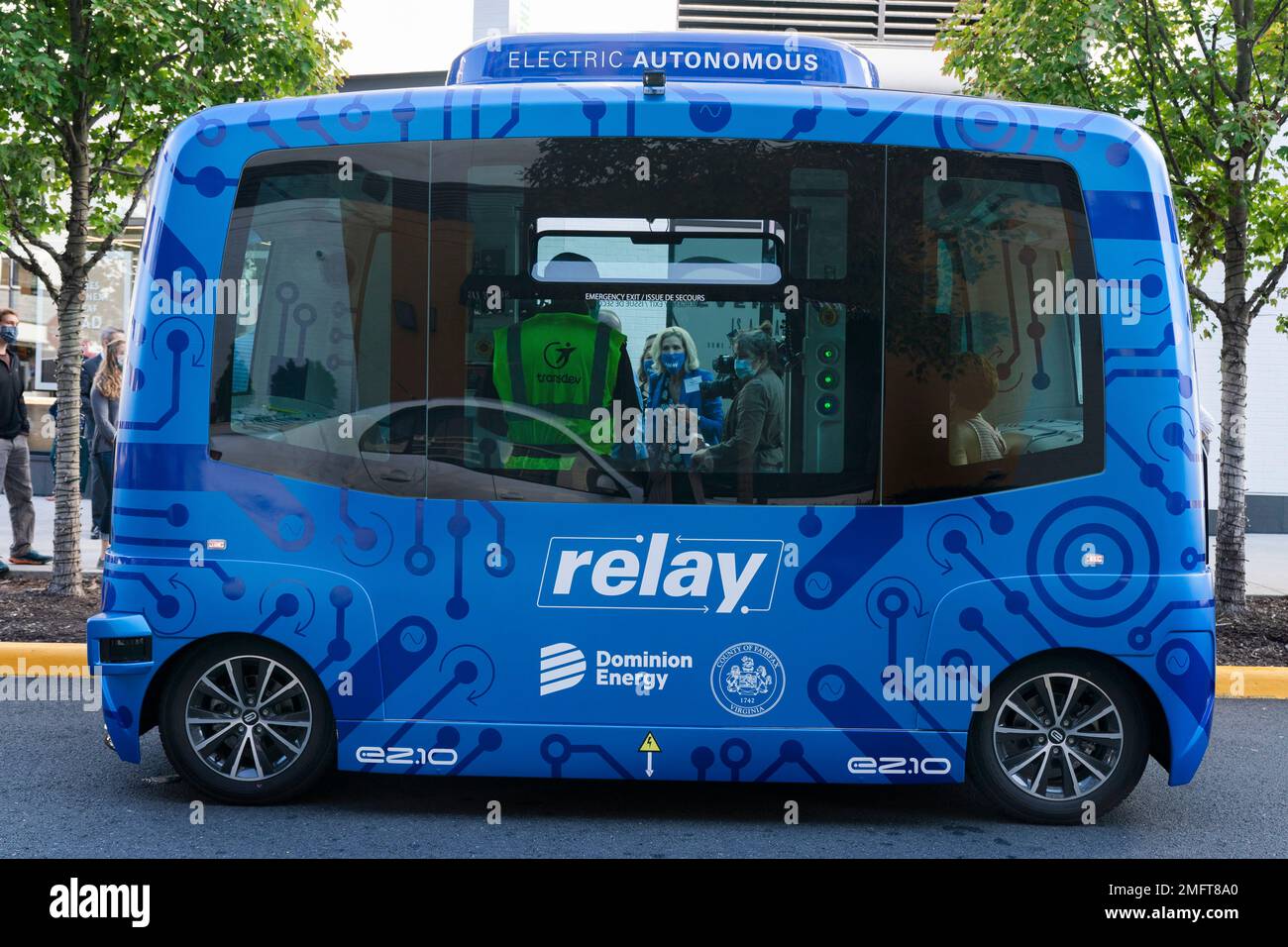 People look at Relay, an electric autonomous vehicle, in Fairfax, Va ...