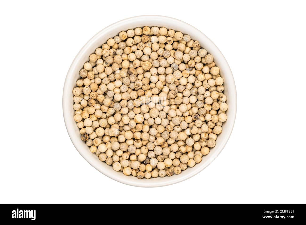 Top view of white peper in ceramic cup on white background with ...