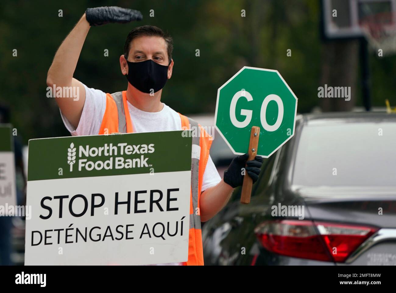 Wearing a mask to prevent to spread of COVID-19, volunteer Michael ...