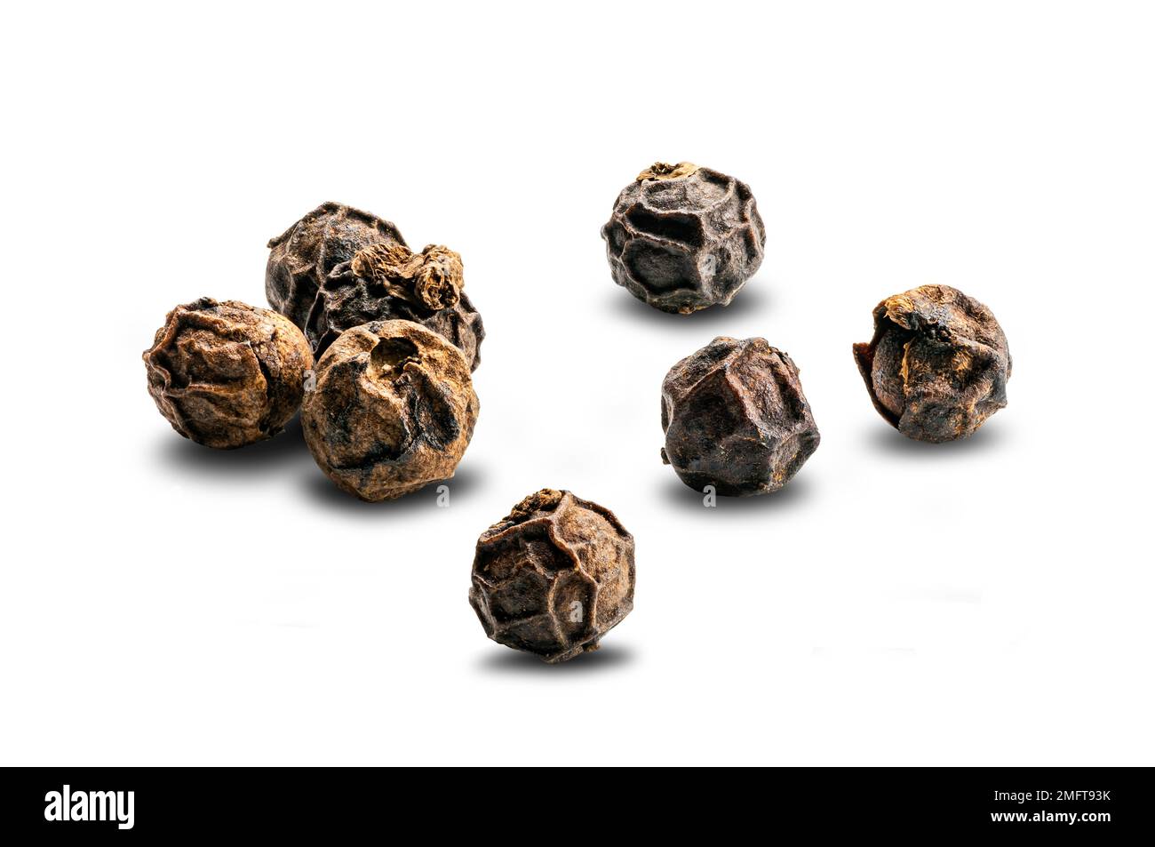 View of dried natural black pepper (Piper nigrum) seeds on white ...