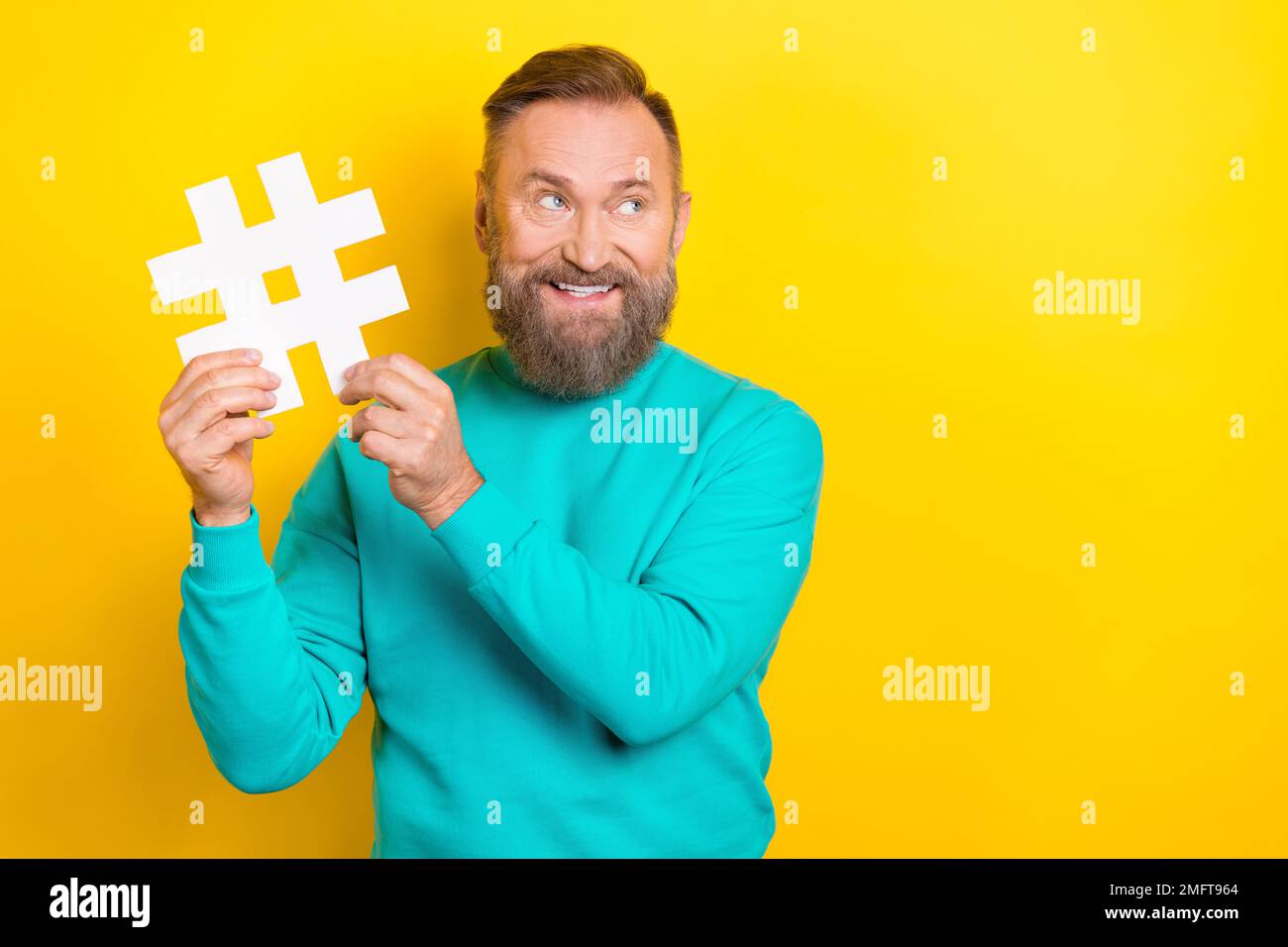 Photo of groomed retired man wear stylish clothes hold paper card look ...