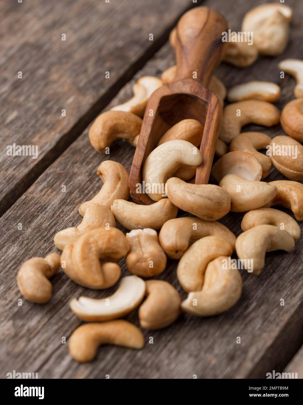 healthy raw cashew nuts small wooden spoon Stock Photo - Alamy