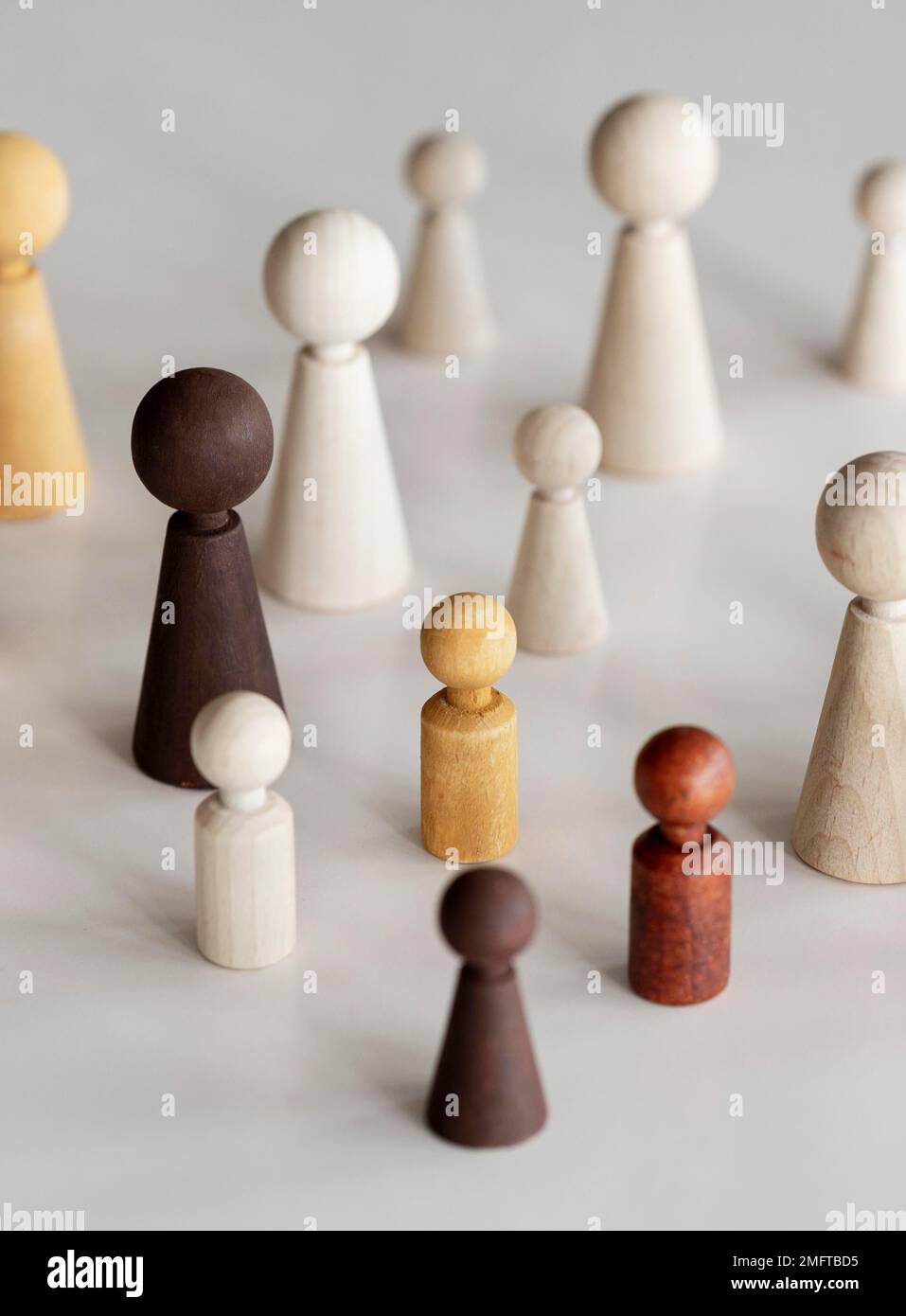 various wooden characters inclusion concept Stock Photo - Alamy