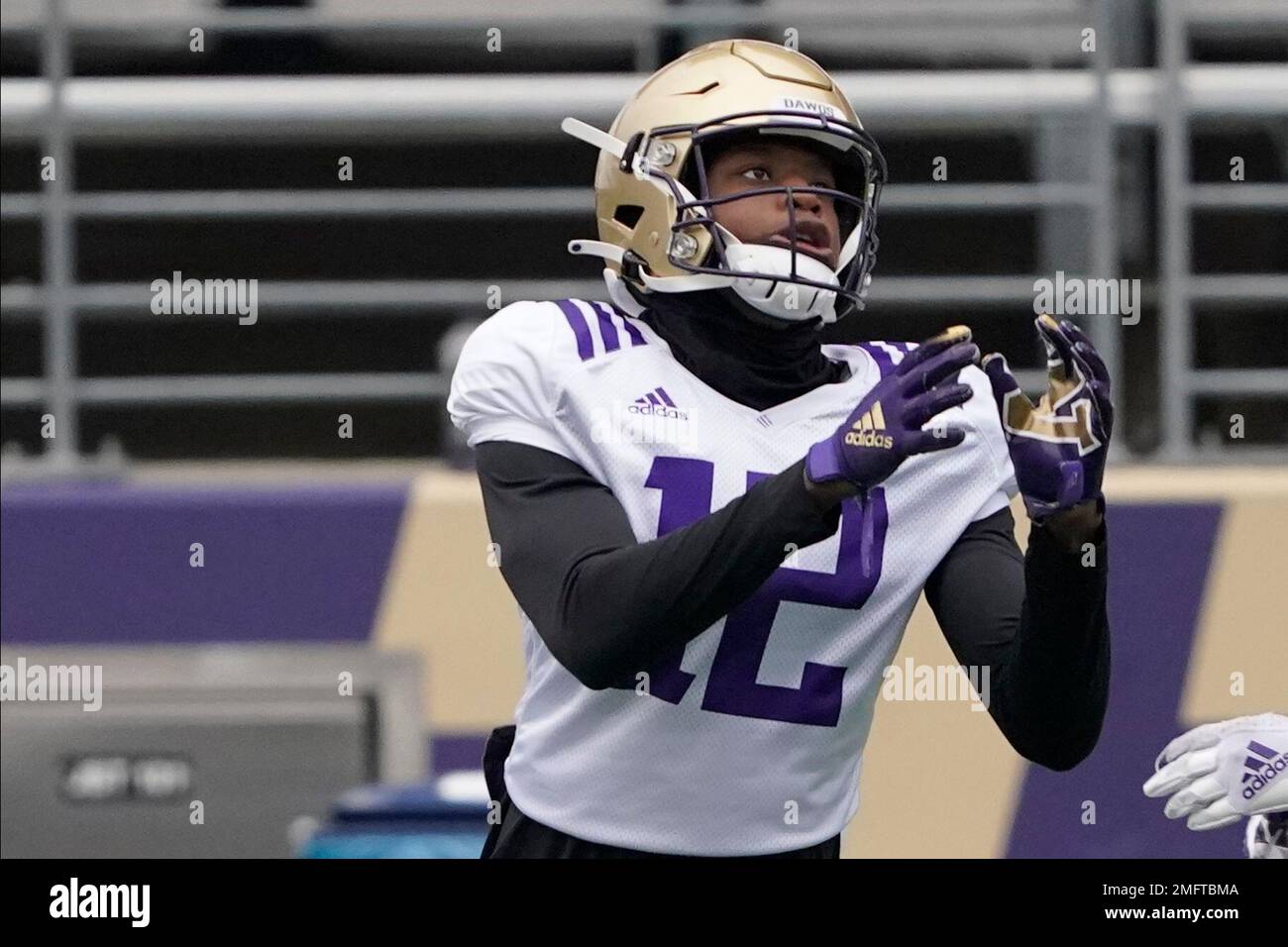 Washington wide receiver Puka Nacua takes part in NCAA college football ...