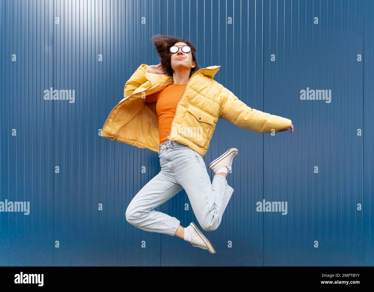 portrait young woman jumping 3 Stock Photo - Alamy