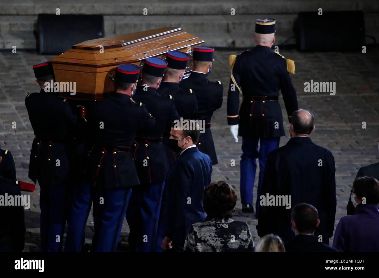 The coffin of slain teacher Samuel Paty is carried in the courtyard of ...