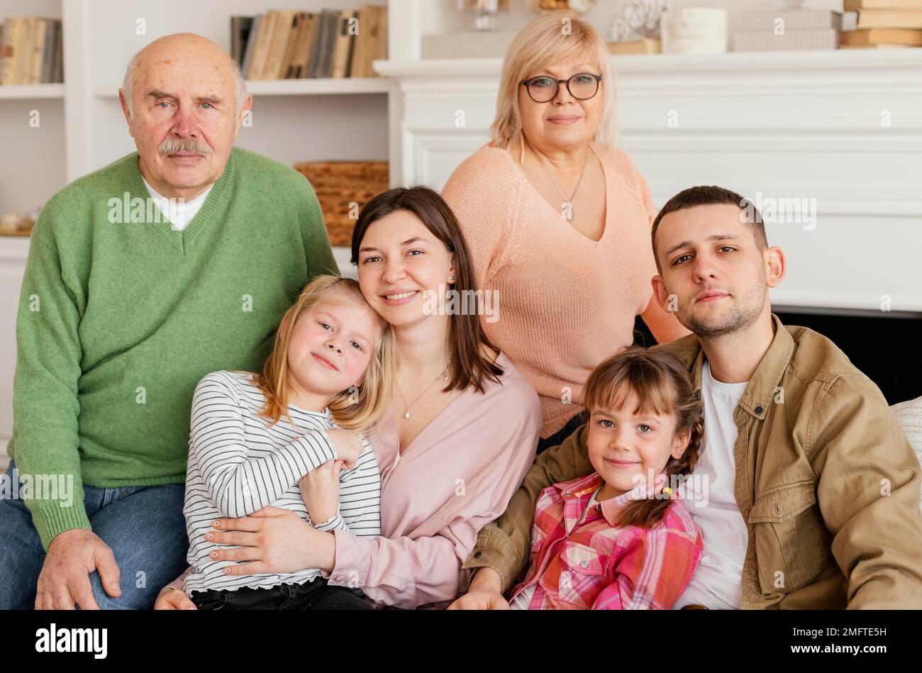 medium shot happy family posing Stock Photo - Alamy