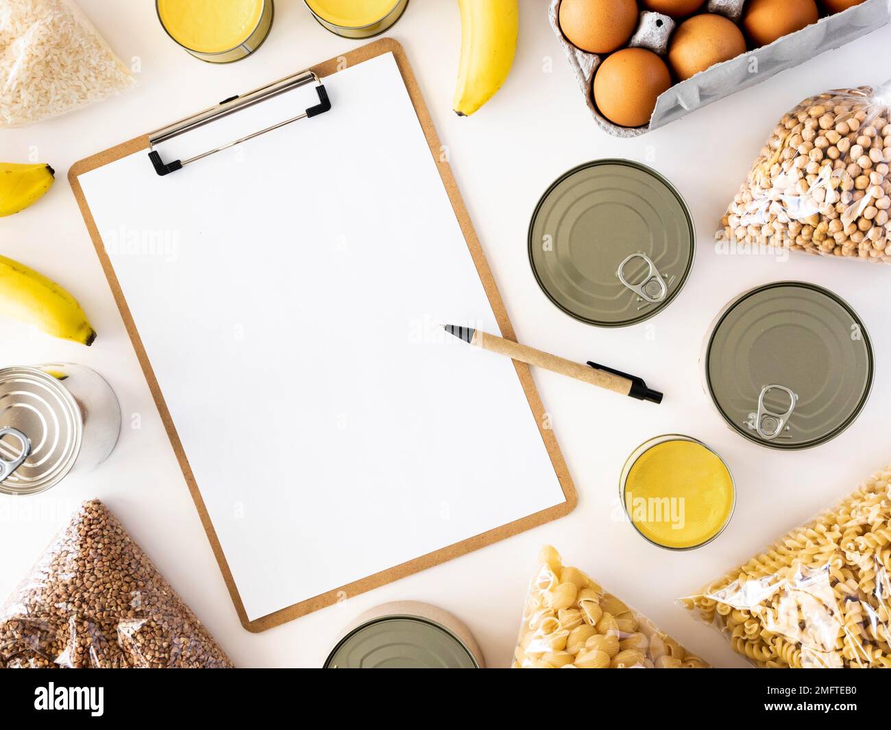 flat lay fresh provisions donation with notepad Stock Photo - Alamy