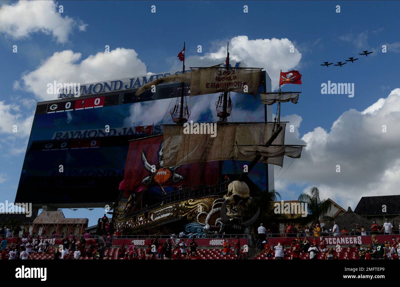 A military flyover before an NFL football game between the Tampa Bay ...