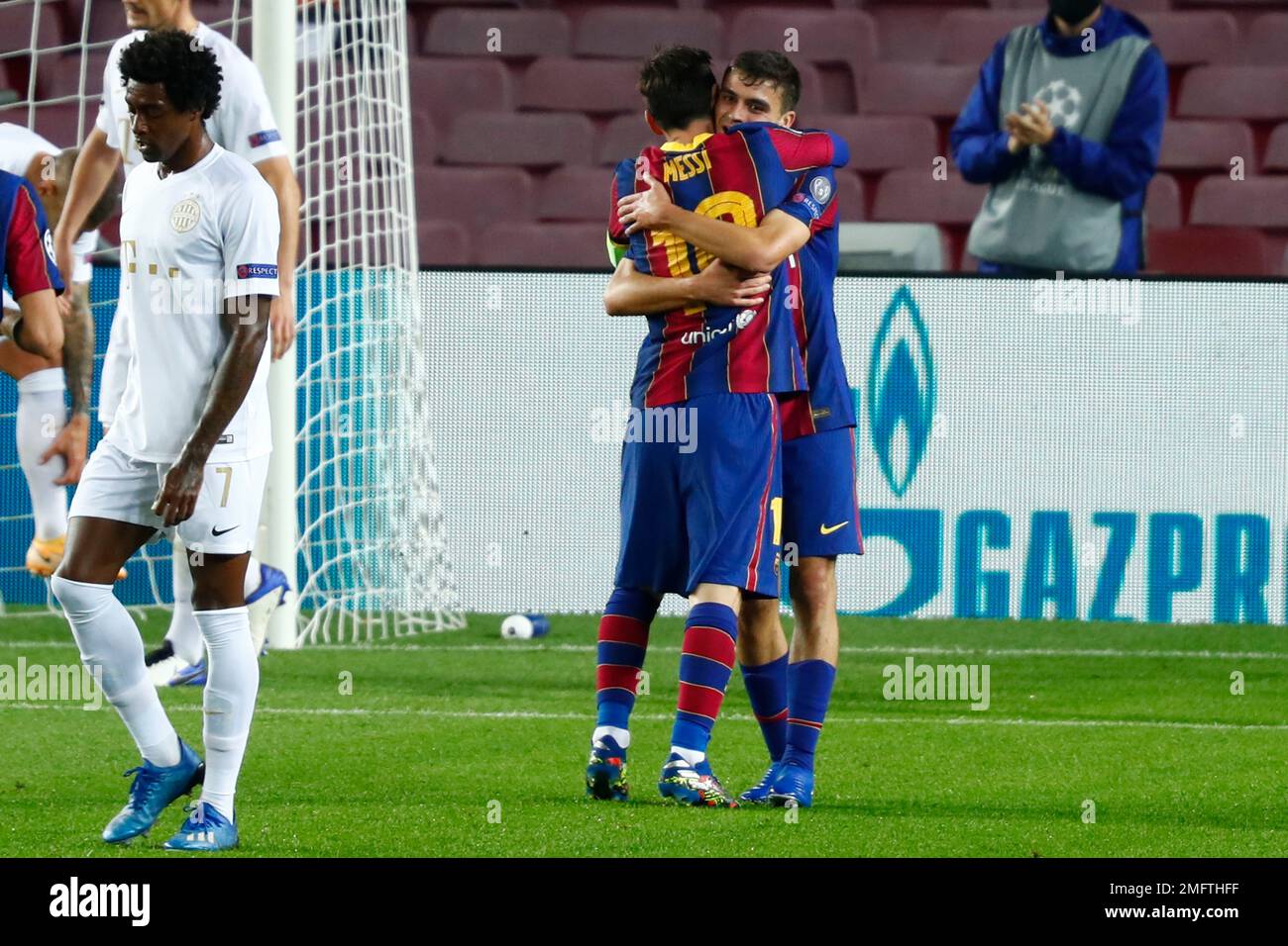 Barcelona's Pedri, background, celebrates with teammate Lionel Messi ...