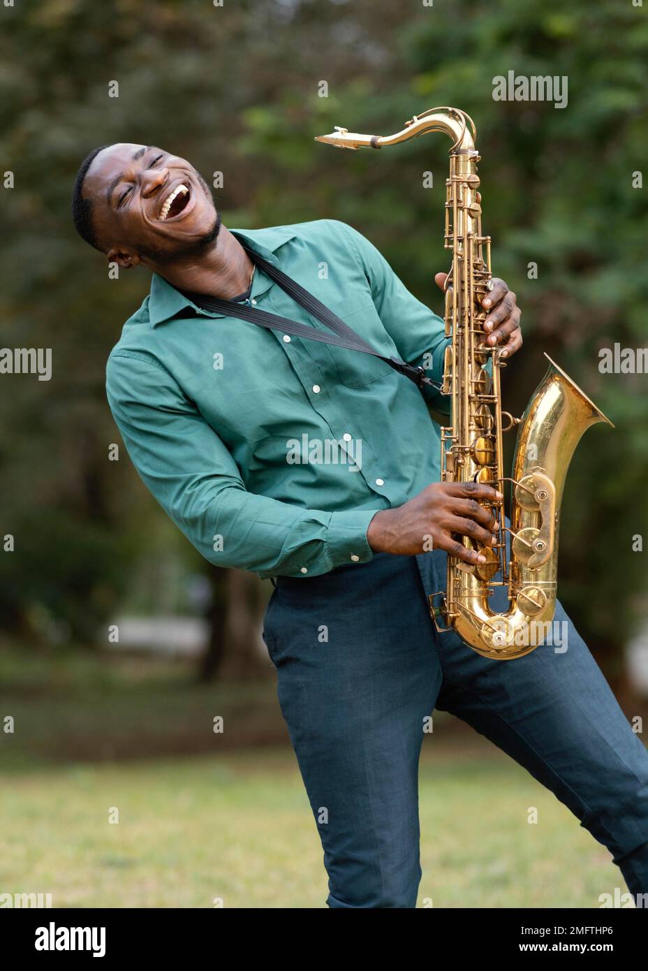 Man playing instrument hi-res stock photography and images - Alamy