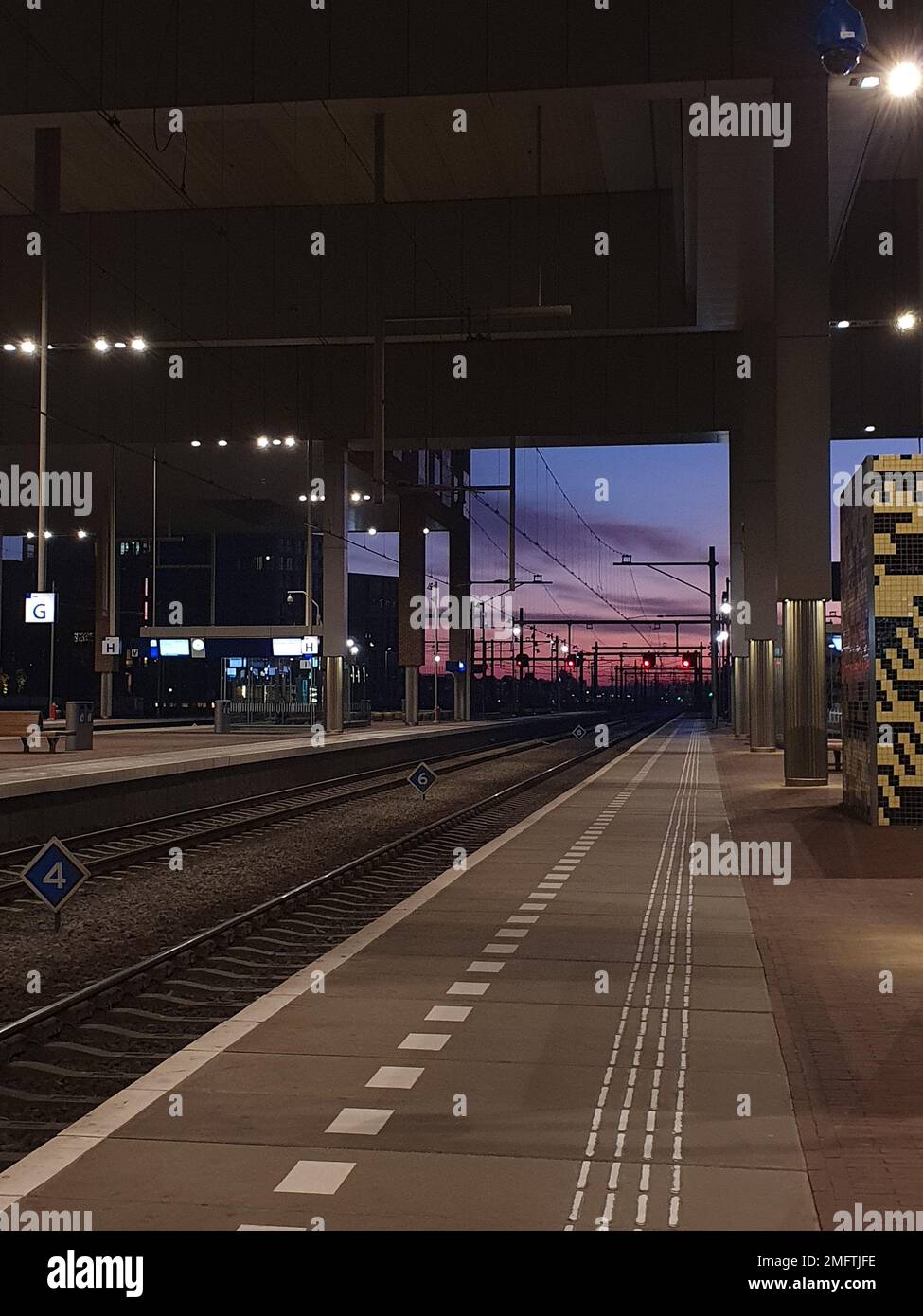 An empty train station during nighttime Stock Photo - Alamy