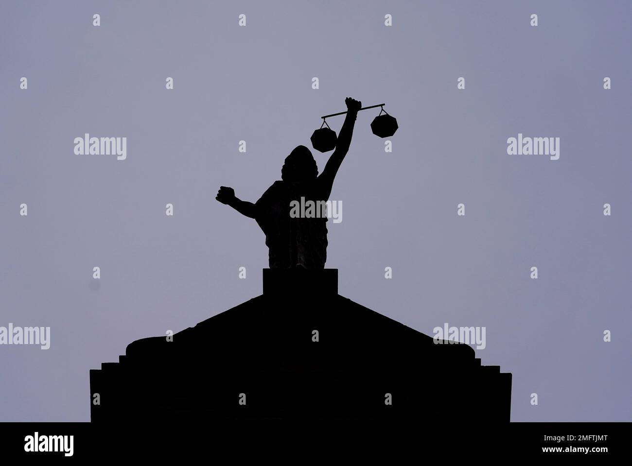 A statue is seen atop the Dallas County Courthouse, Tuesday, Oct. 20 ...