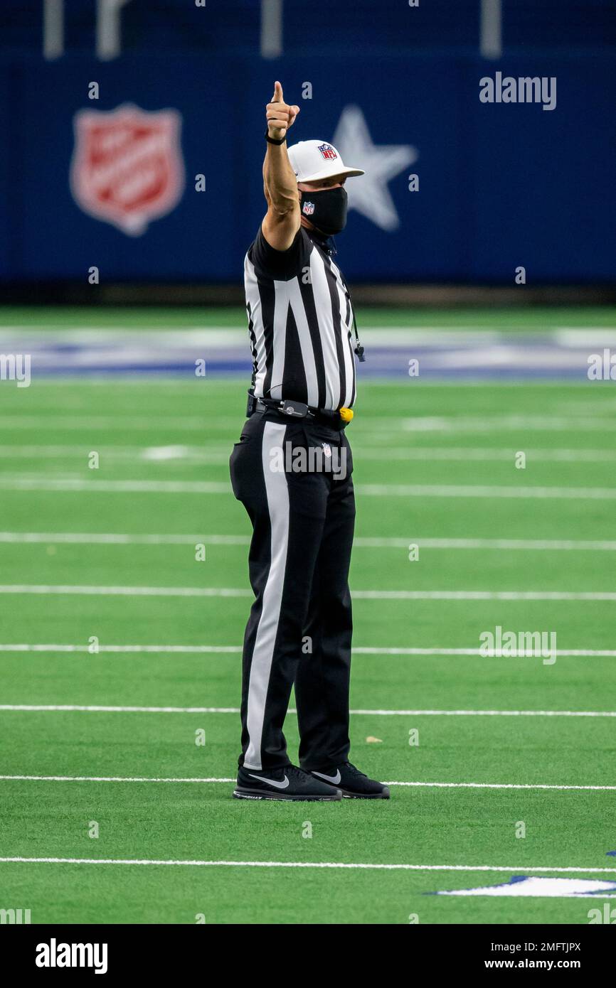 Referee Clete Blakeman (34) signals a first down during an NFL football ...