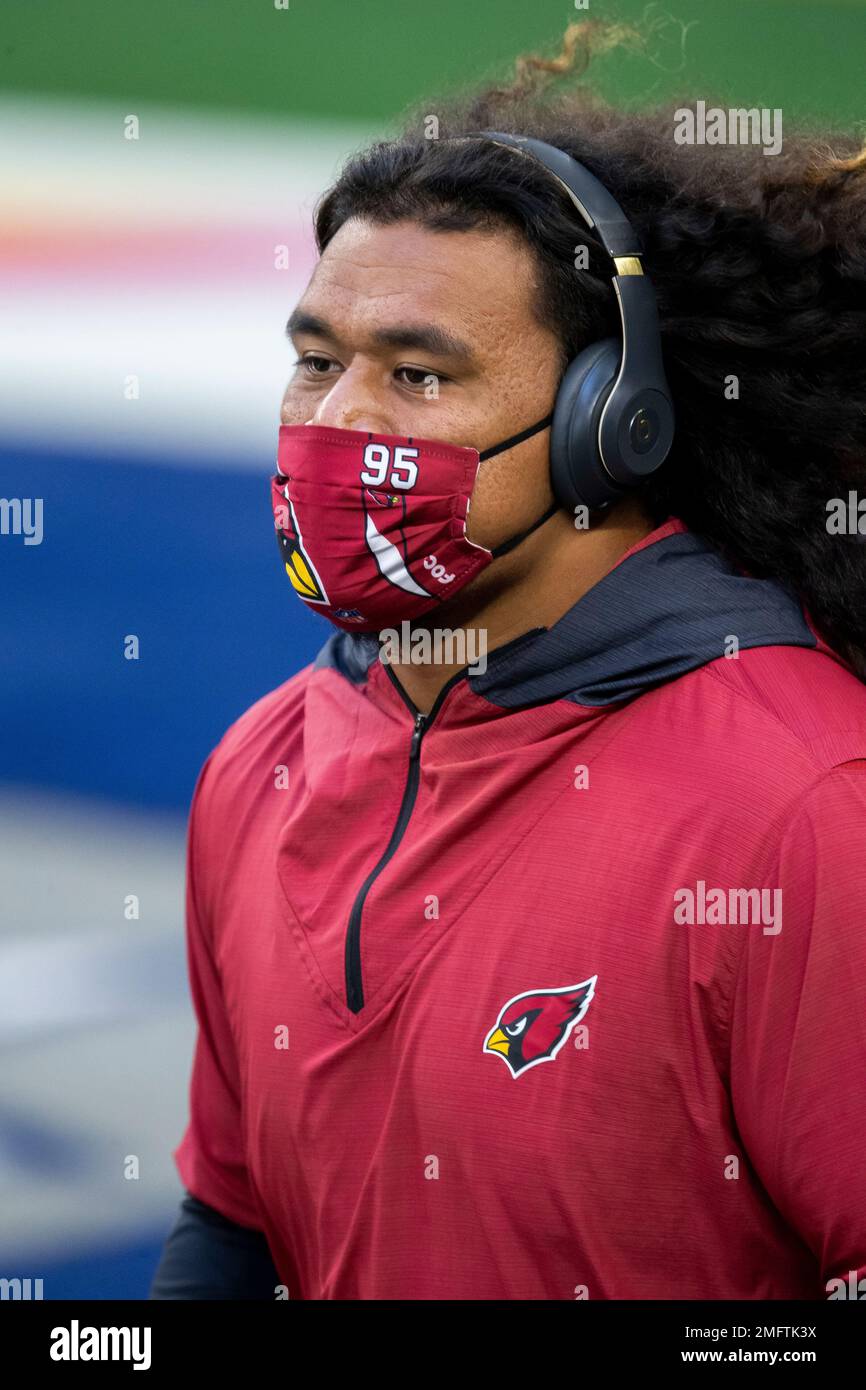 Arizona Cardinals defensive tackle Leki Fotu (95) wears a FOCO mask ...