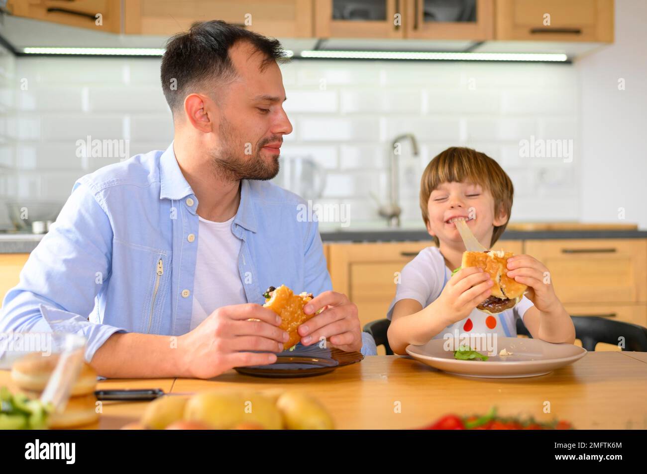 Father eating burgers hi-res stock photography and images - Alamy