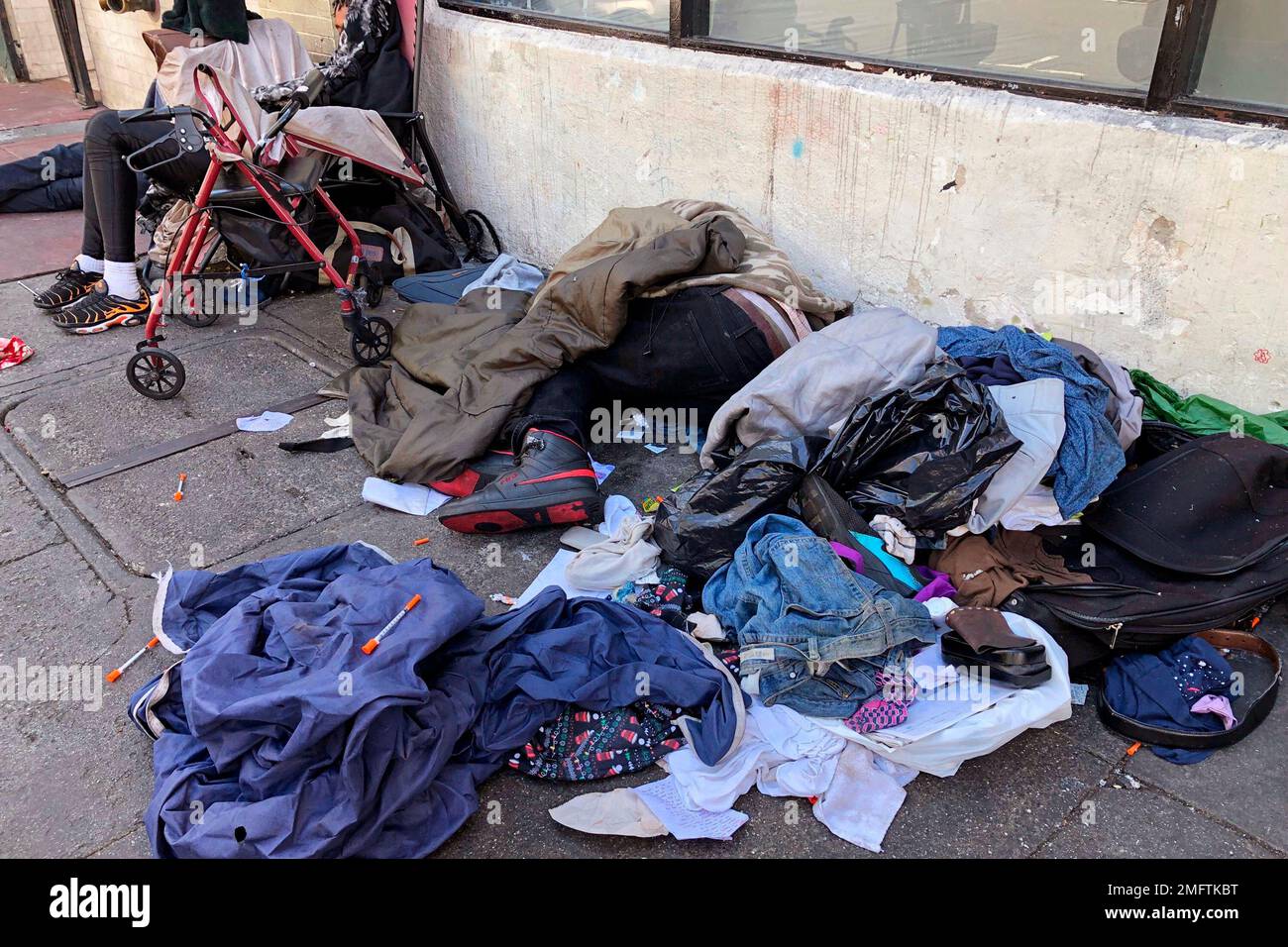 FILE - In this July 25, 2019, file photo, people sleep amongst ...