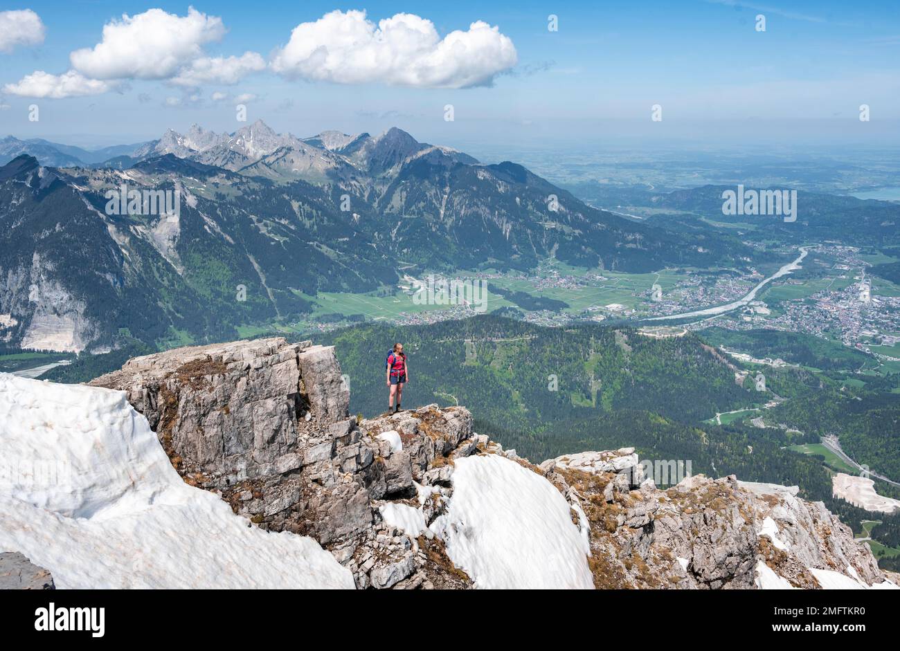 Hiker at a rock edge, view from Thaneller, eastern Lechtal Alps, Tyrol ...
