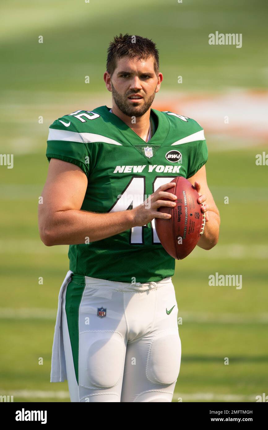 New York Jets long snapper Thomas Hennessy (42) warms up on the field ...