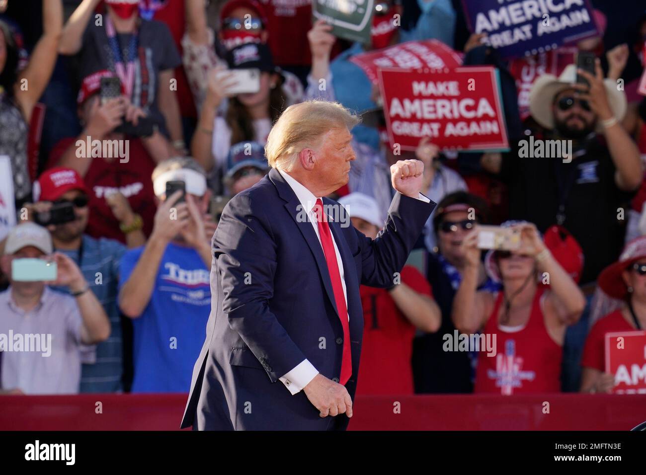 President Donald Trump gives a fist pump to the crowd after speaking at ...