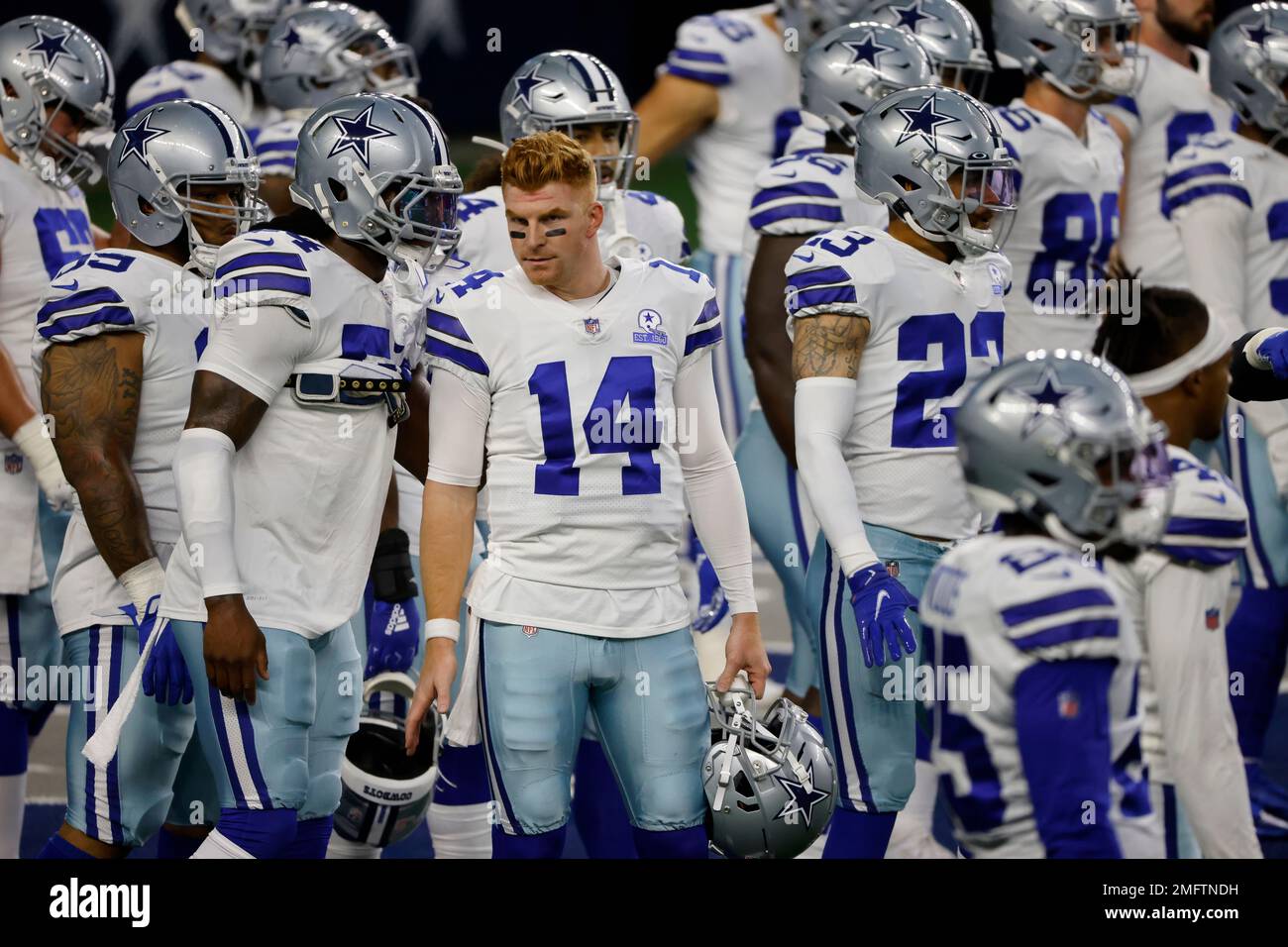 Dallas Cowboys' Jaylon Smith, center left and Andy Dalton (14) talk ...