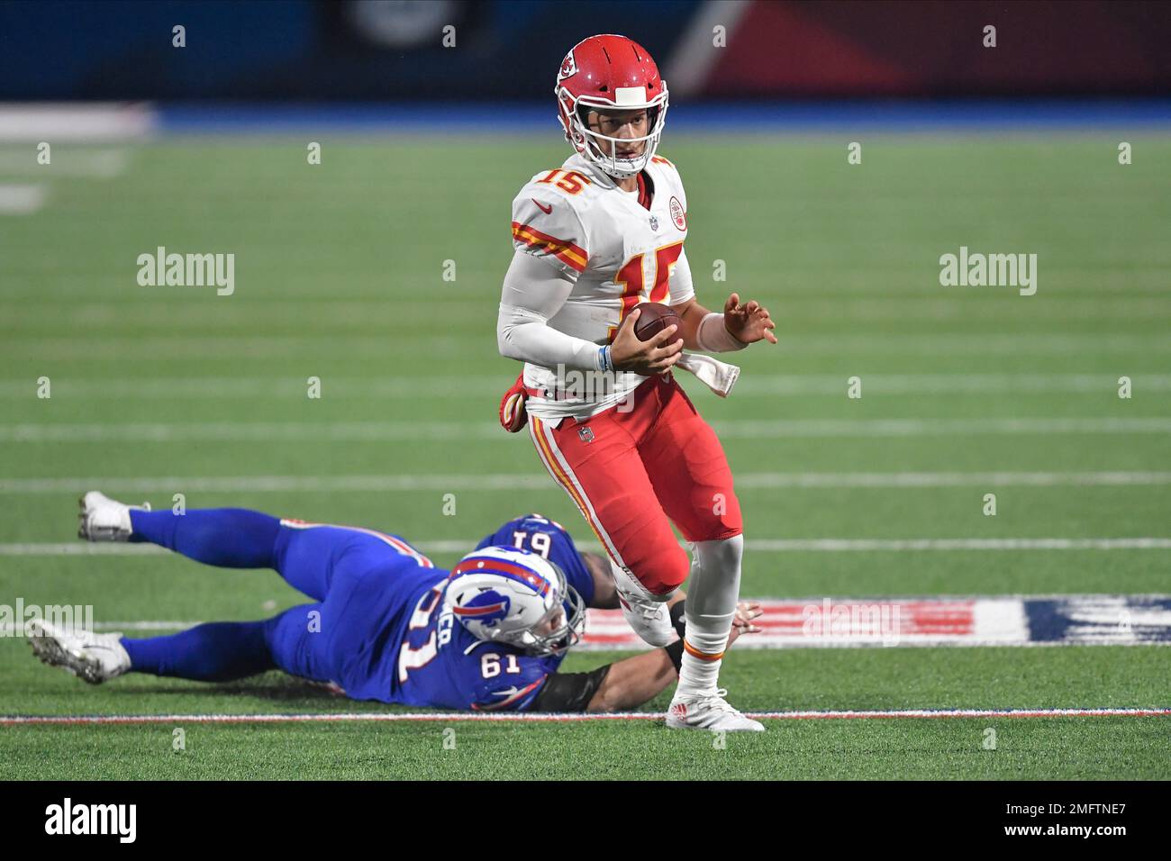 Kansas City Chiefs quarterback Patrick Mahomes (15) evades Buffalo ...
