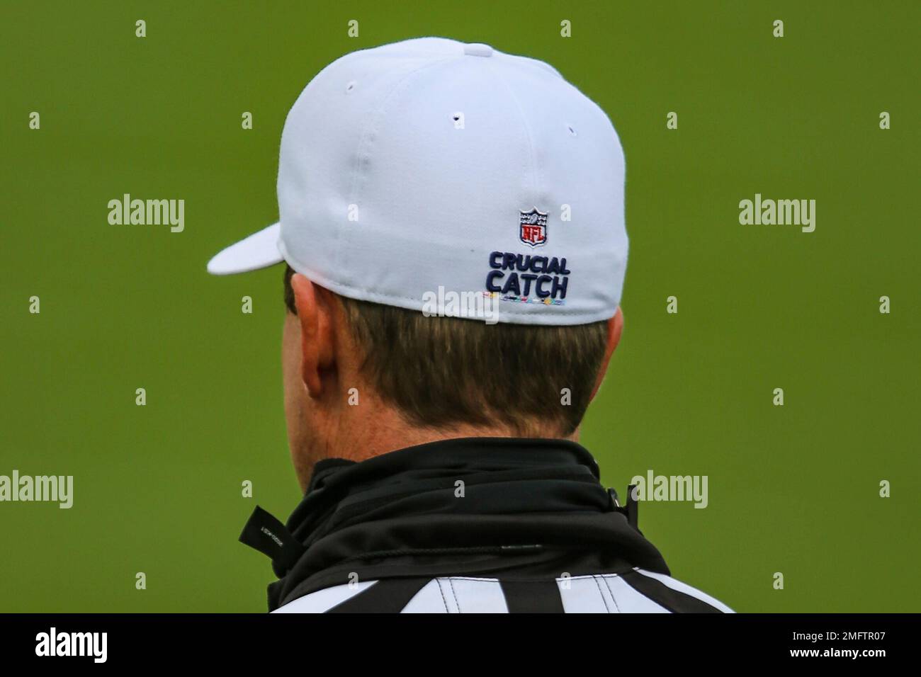 Umpire Shawn Hochuli (83) wears a Crucial Catch logo on his hat during ...