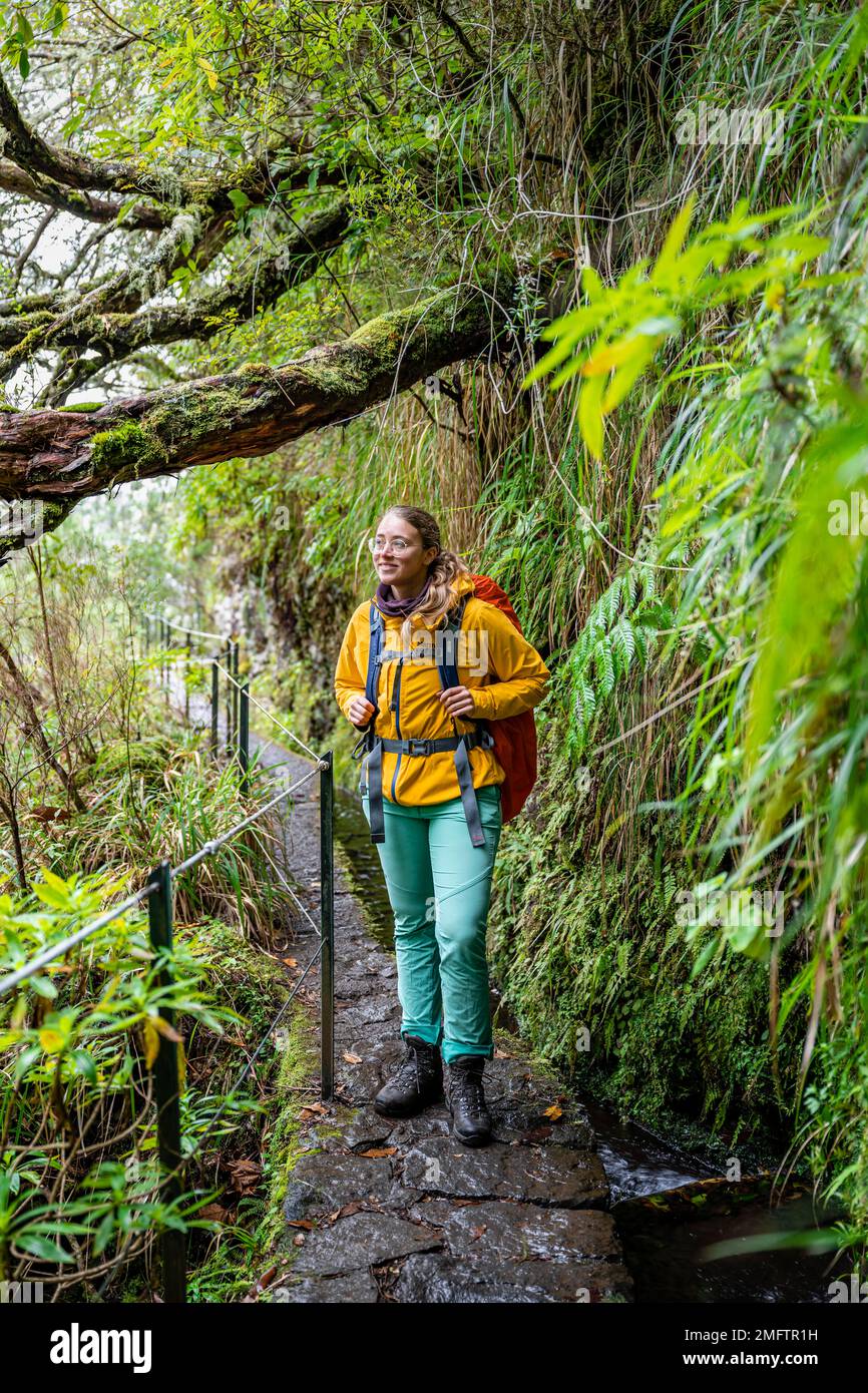 Hiker on a Levada, PR9 Levada do Caldeirao Verde, Madeira, Portugal ...