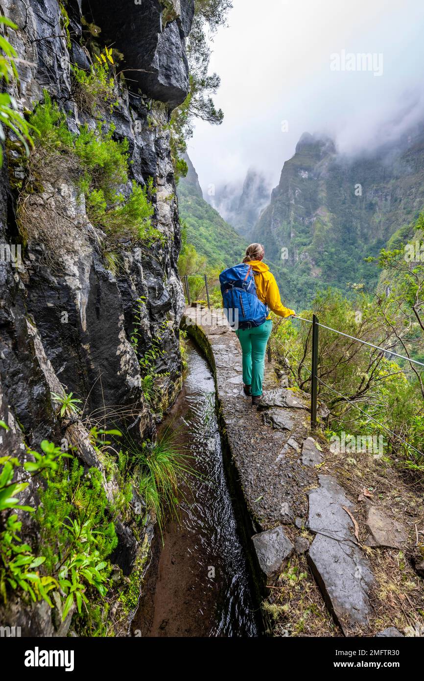 Hiker on a Levada, PR9 Levada do Caldeirao Verde, Madeira, Portugal ...