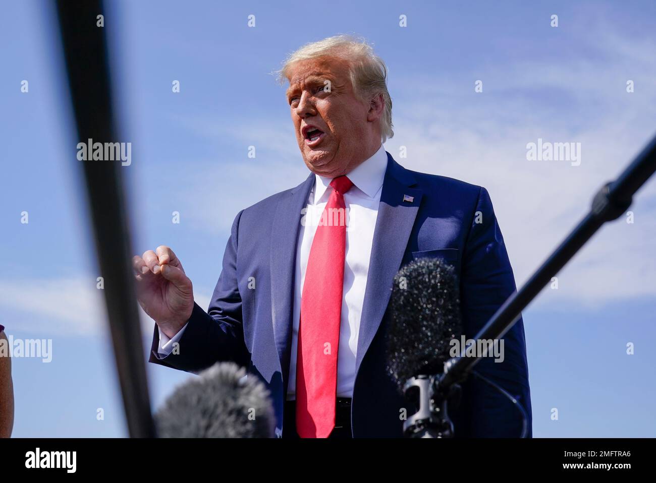 President Donald Trump talks to reporters at Phoenix Sky Harbor ...