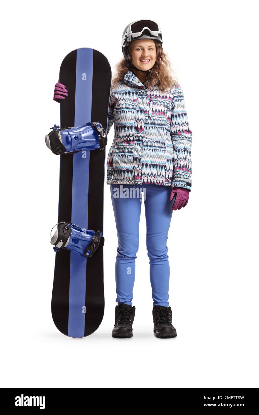 Full length portrait of a female with snowboard standing and looking at ...